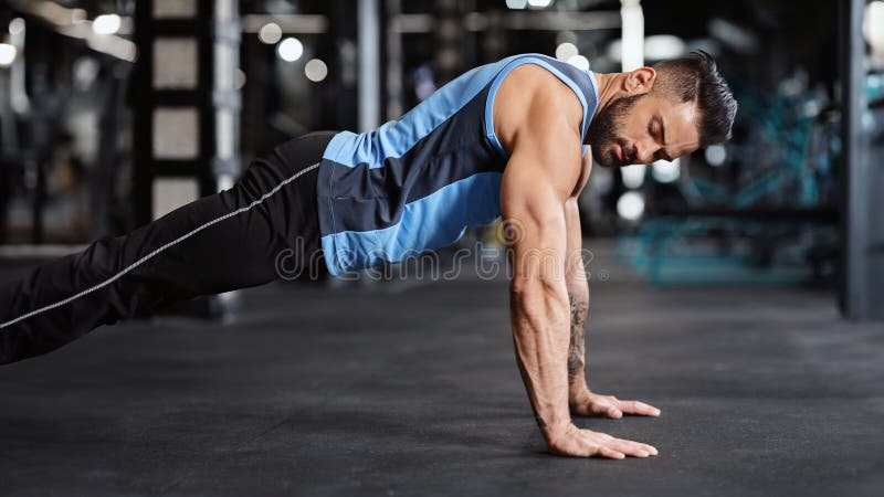 Sporty Young Man Doing Pushups in Gym Stock Photo - Image of confident ...