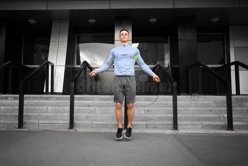 Sporty Young Man Jumping Rope Outdoors Stock Photo - Image of rope ...
