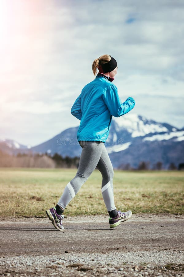 Sporty Young Woman is Jogging in Nature Stock Image - Image of girl ...