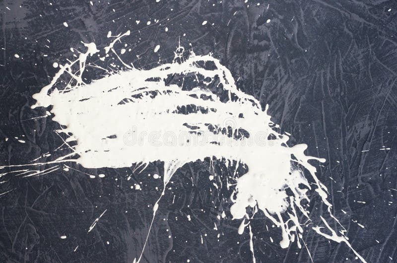 A Spot of White Spilled Paint on a Concrete Textured Surface Stock ...