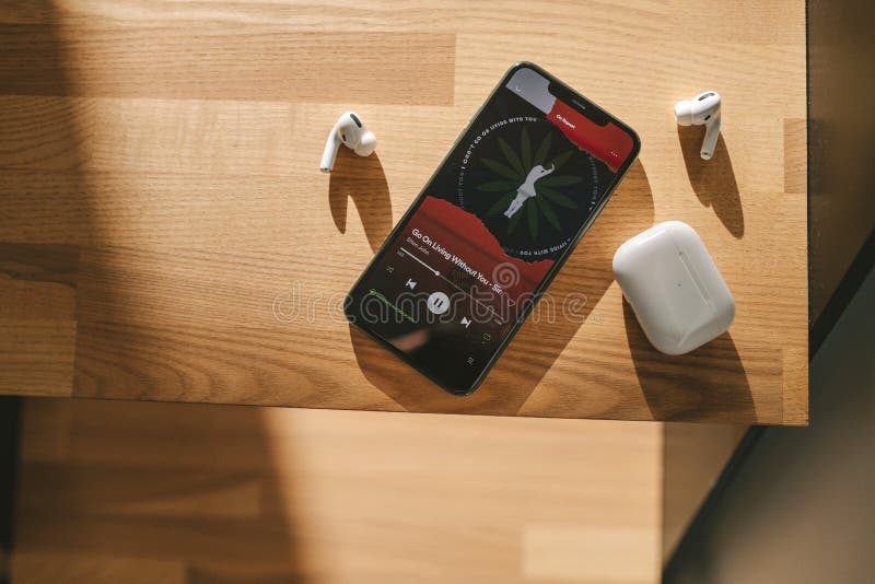 Spotify App on the Screen and Apple Airpods Pro Editorial Photography ...