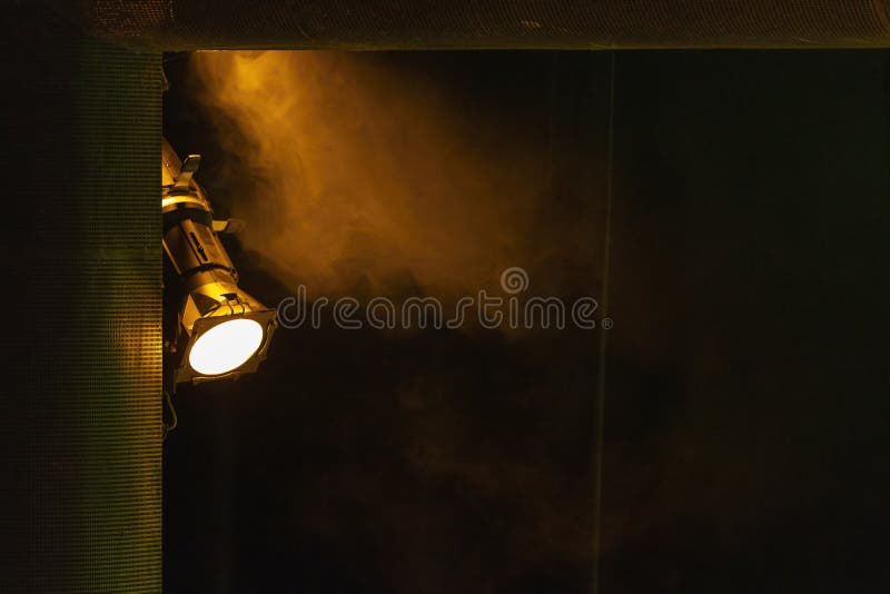 Dramatic Spotlight Casting Shadows in Smoky Atmosphere Stock Photo ...