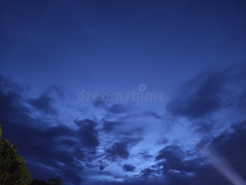 The Spotlight in the Lower Right Corner Points To the Sky at Night ...