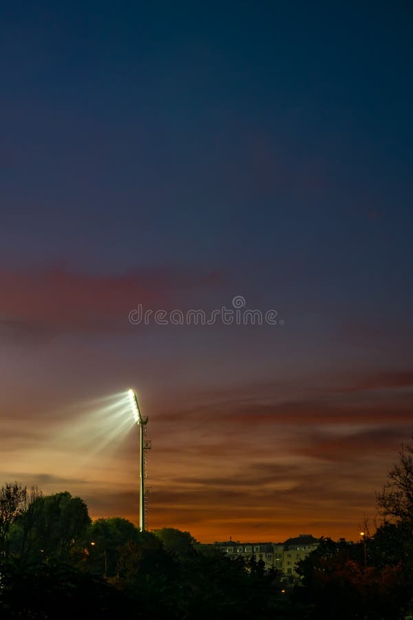 Spotlight pole at sunset stock image. Image of light - 148601431