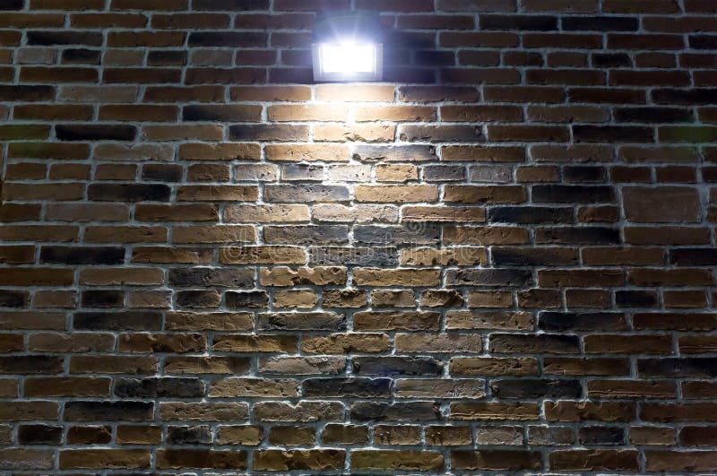 Spotlight on Red Brick Wall at Night Stock Image - Image of ...