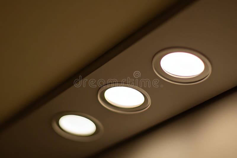 Spotlights Highlight an Otherwise Bare White Wall within an Art Gallery ...