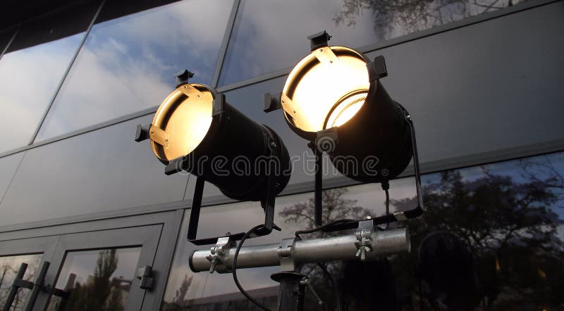Spotlights on Tripod Over Glass Wall Stock Photo - Image of background ...