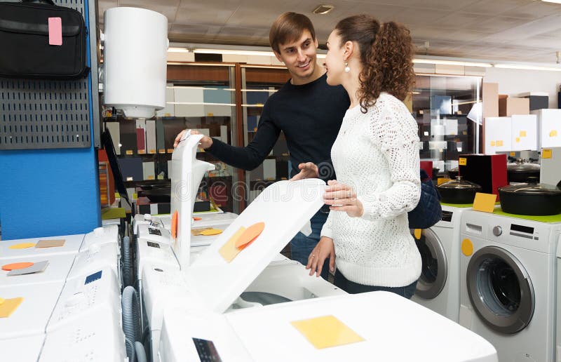 Spouses Selecting New Clothes Washer Stock Photo - Image of domestic ...