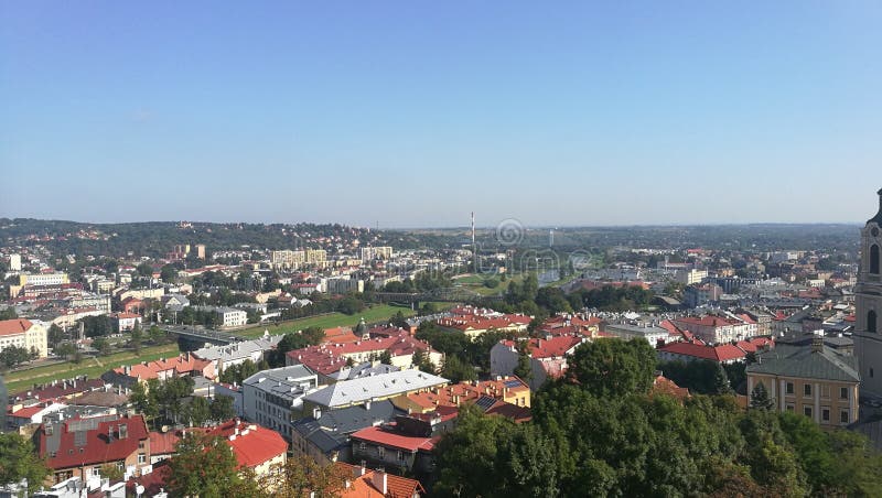 A Sprawling Cityscape Unfolds Beneath the Wide Expanse of the Sky ...