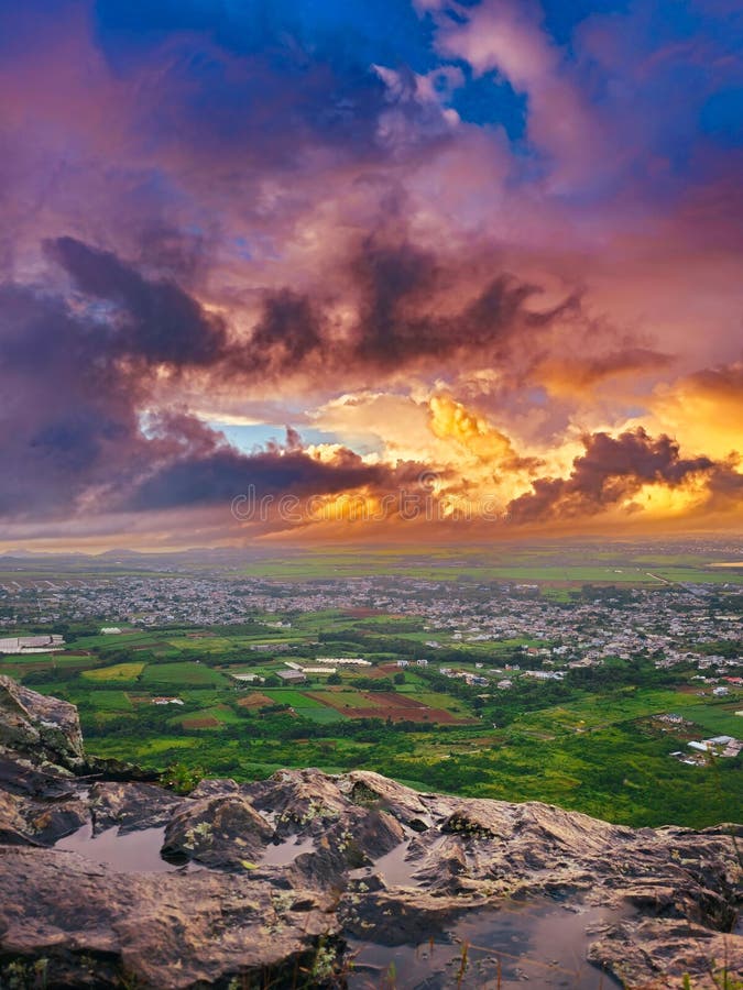 Sprawling Grassy Landscape Surrounded by Lush Fields and Illuminated by ...