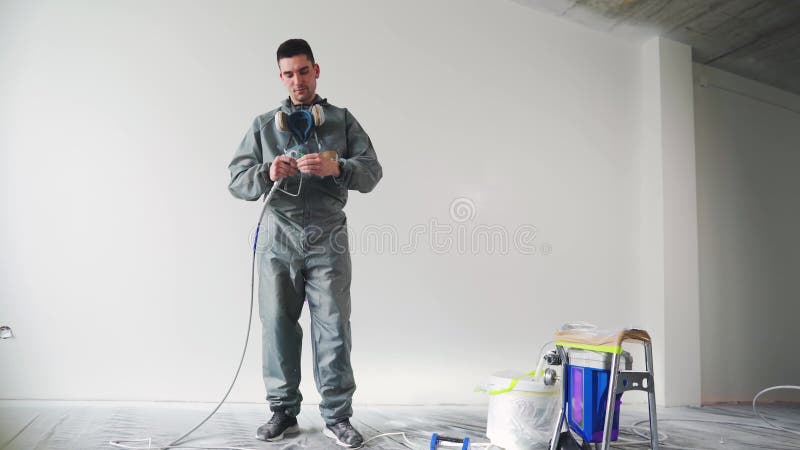 Spray Airless Method, Spray Paint. Male Painter and Assistant Painter ...