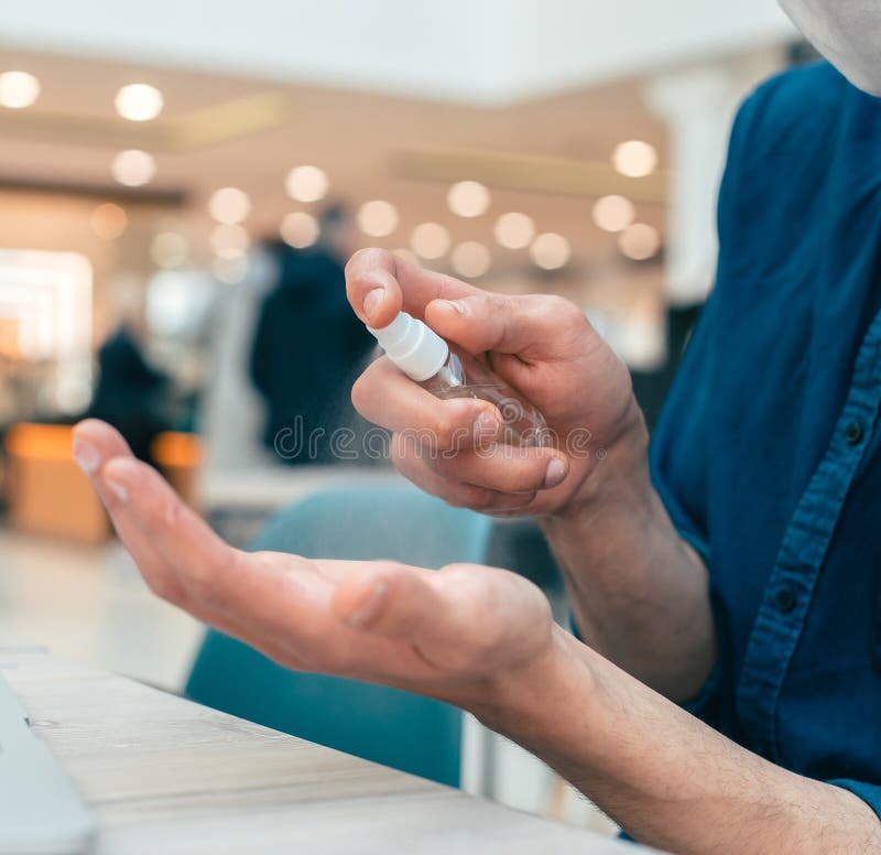 Spray with Antiseptic in the Hands of a Young Man Stock Photo - Image ...