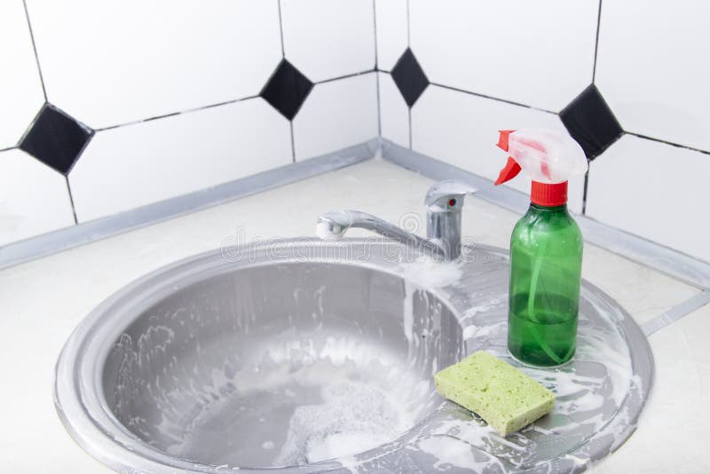 Spray Bottle and Cleaning Tools on the Kitchen Countertop. Cleaning ...