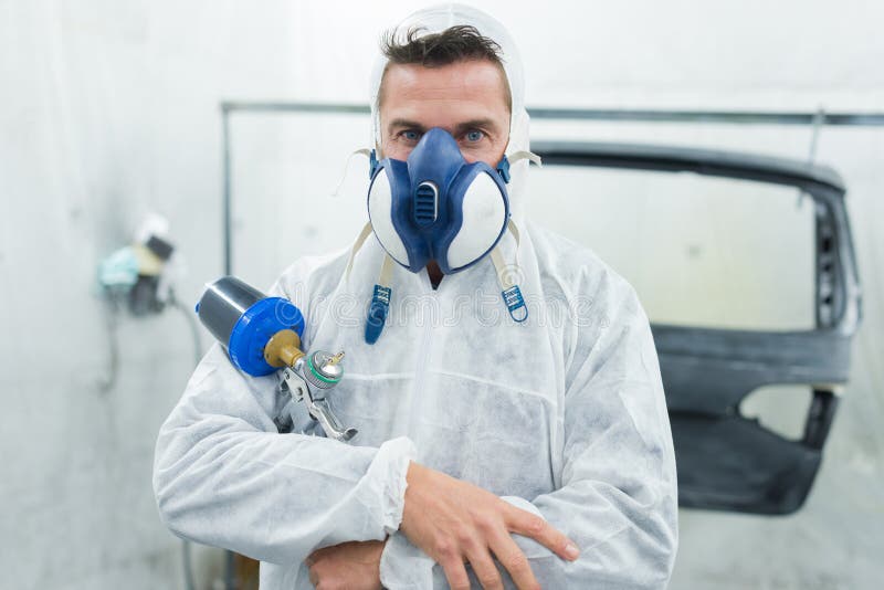 Spray Painter Looking at Camera Stock Image - Image of glove, project ...