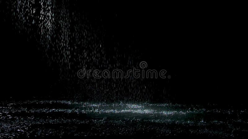 Spray Spatters Rain Fall Against on the Water Surface Which Glow. Black ...