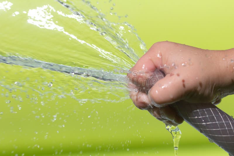 Spray Water from a Hose Child`s Hand Stock Image - Image of house ...