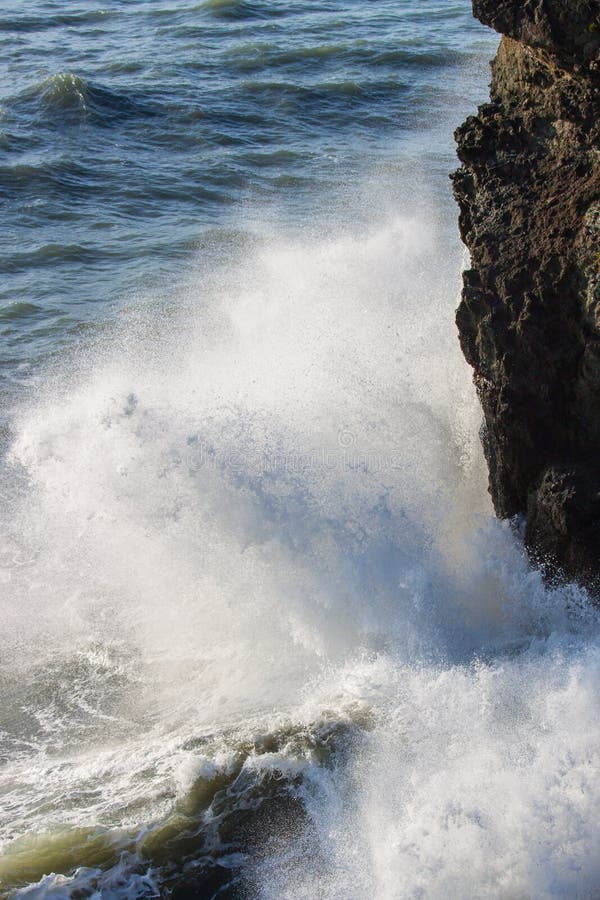 Spray from Waves Hitting a Rock Stock Image - Image of cliff, danger ...