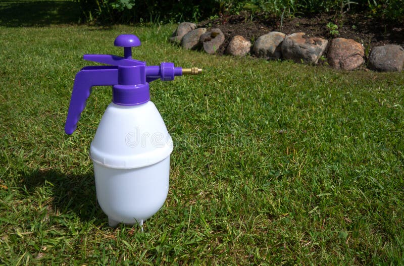 Sprayer for Garden on the Grass Stock Image - Image of gardener, plant ...