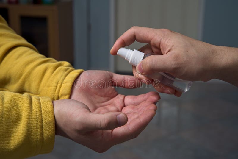 Spraying Alcohol or Disinfection Liquid on Hands To Prevent Spread of ...
