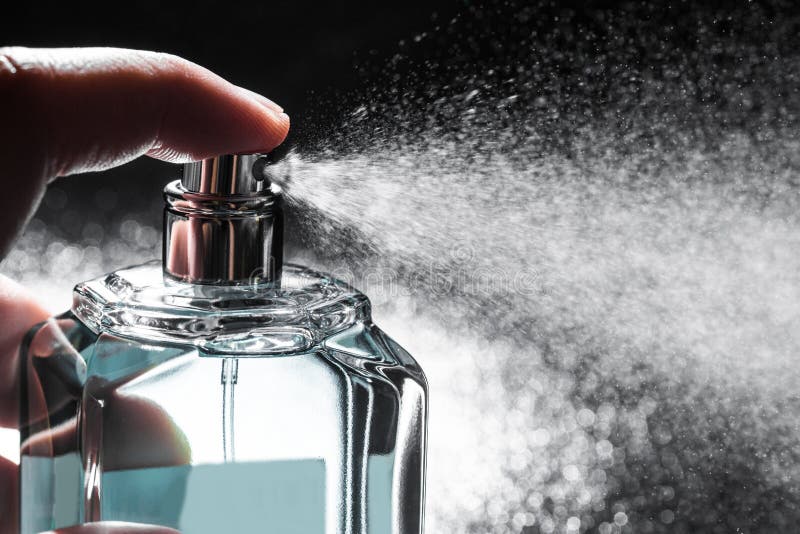 Spraying Perfume on Dark Background, Closeup Stock Image - Image of ...