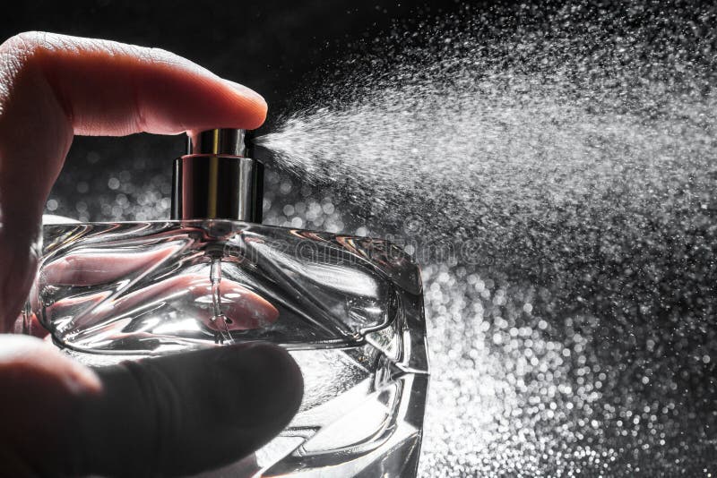 Woman Holding Perfume Bottle Stock Image - Image of dress, fragrance ...