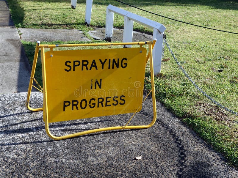 Spraying in Progress Sign stock image. Image of spraying - 47871413