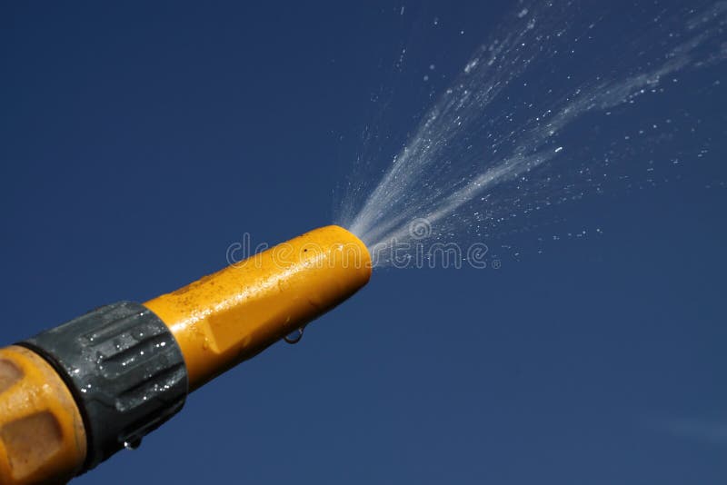 Spraying water stock image. Image of blue, spraying, watering - 19236027