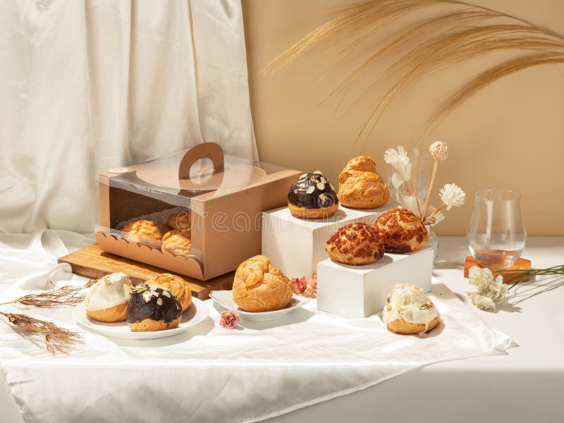 A Spread of Charming Cream Puffs and Assorted Pastries is Elegantly ...