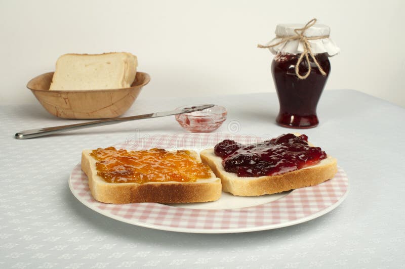 Spread jam on bread stock image. Image of food, hand - 28379647