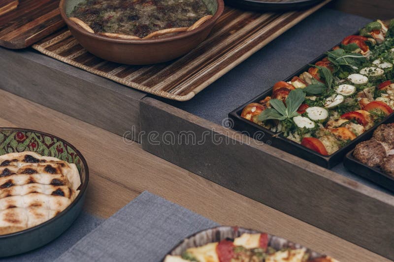 Spread of Various Appetizers Including Flatbread, Savory Tart, and ...