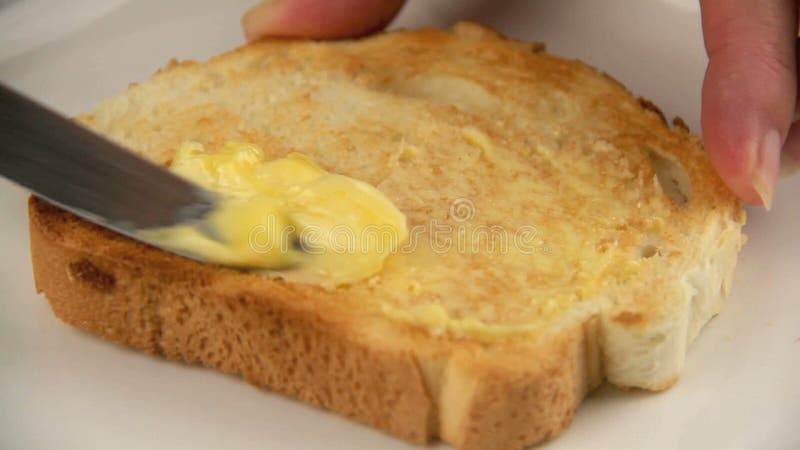 Spreading Butter on Toast stock video. Video of preparing - 118752595