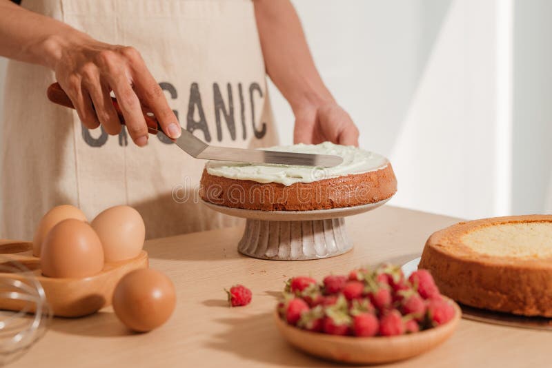 Spreading Cream on Sponge Cake. Making Red Velvet Process Stock Photo ...