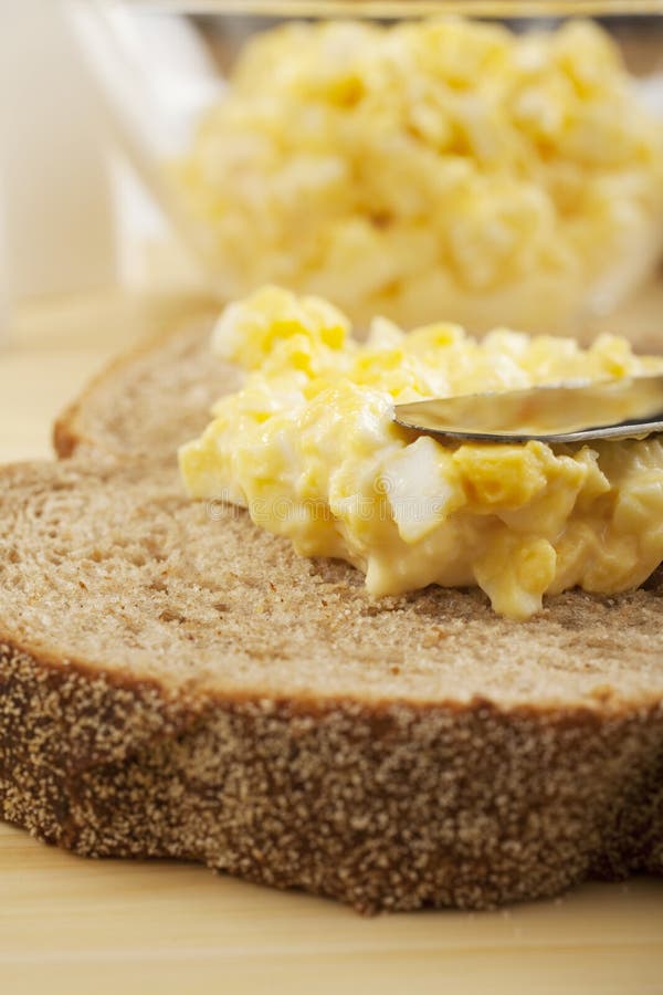Spreading Egg Mayonnaise on Bread Stock Photo - Image of food, knife ...