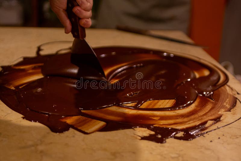 Spreading fresh chocolate stock photo. Image of confectionery - 298504988