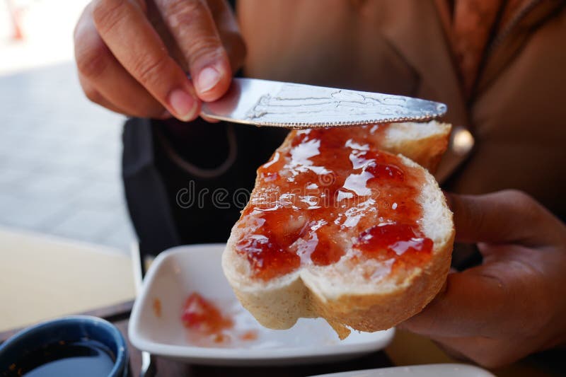 Spreading Jam on Fresh Toast at a Caf Stock Image - Image of food ...
