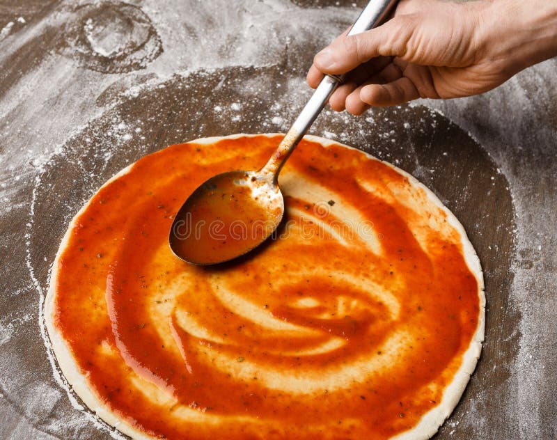 Spreading Tomato Sause on Pizza Base, Closeup Stock Image - Image of ...
