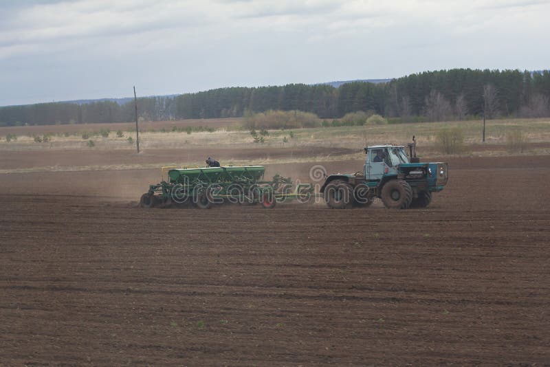 Spring Agricultural - Tractor Sowing Crops at Field Stock Image - Image ...