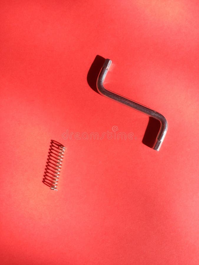 Spring and Allen Key on Red Background Stock Image - Image of spring ...