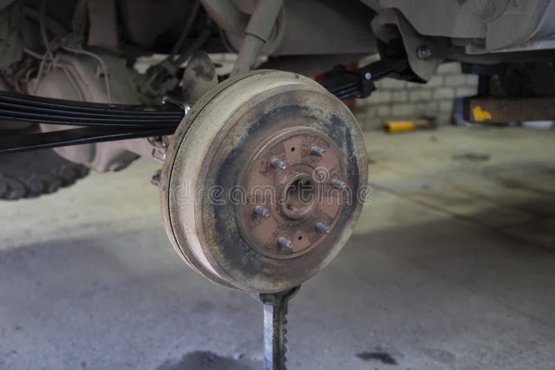 A Spring for a Car.Replacement of the Spring on the Car Stock Image ...