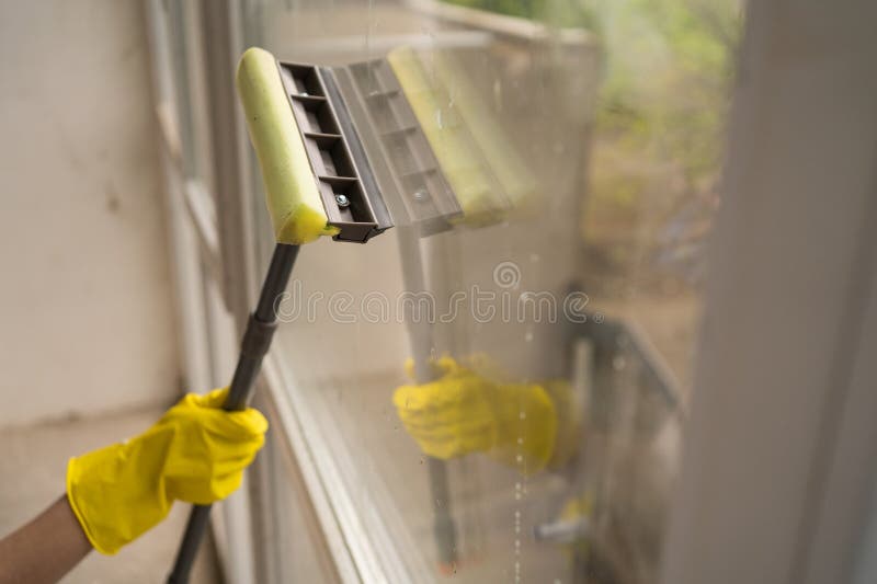 Spring Cleaning Concept. Washing Windows. Cleaner Washing a Windows ...