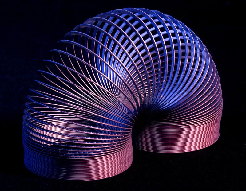 Blue Flexible Slinky Spring Editorial Photography - Image of abstract ...