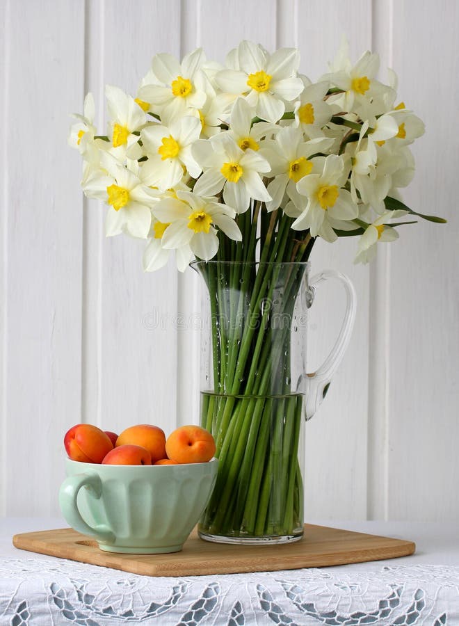 Spring Cottage Composition with Daffodils in a Glass Jug on a Table ...