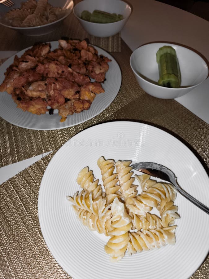 Spring Dinner Table Setting with Pasta, Fried Chicken Nuggets, Cucumber ...