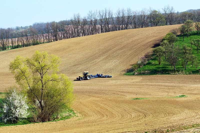 Spring Farmland with Tractor Stock Image - Image of blossom, farm: 19300939