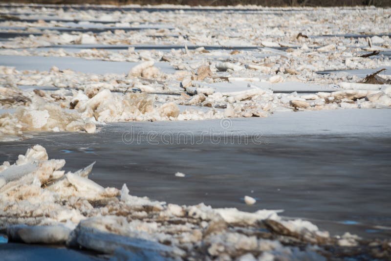 Spring Floods. Sedimentation of Ice Blocks in a River that Forms an Ice ...