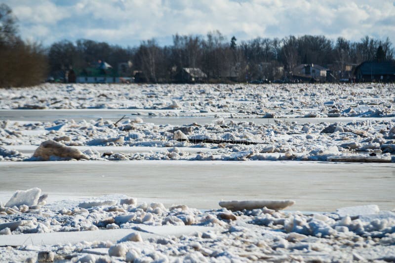 Spring Floods. Sedimentation of Ice Blocks in a River that Forms an Ice ...