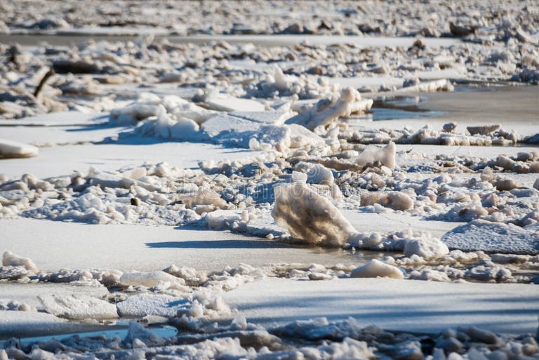 Spring Floods. Sedimentation of Ice Blocks in a River that Forms an Ice ...