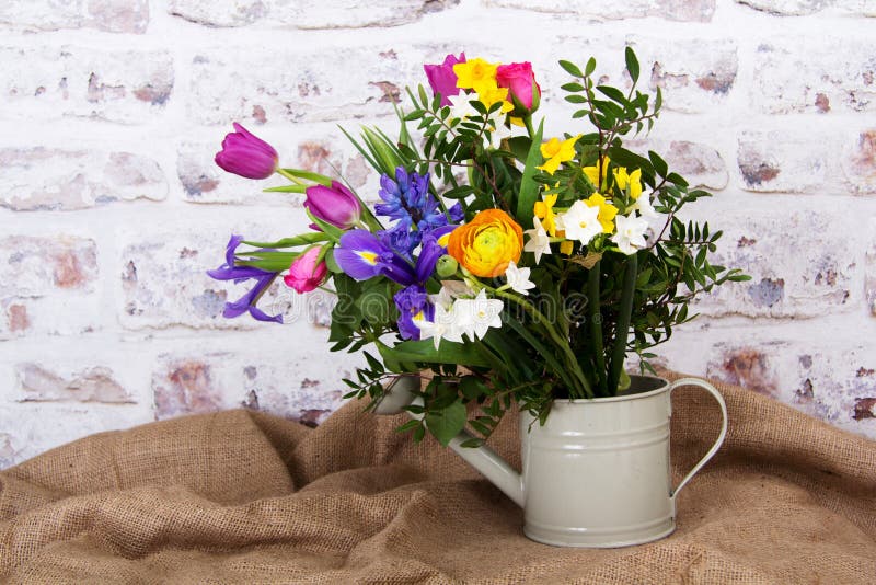 Spring Flower Arrangement Against a Rustic Background Stock Image ...