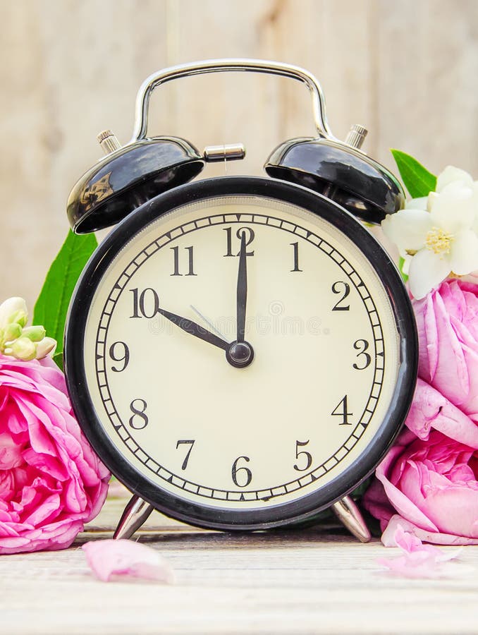 Spring Flowers and Alarm Clock. Change the Time Stock Image - Image of ...