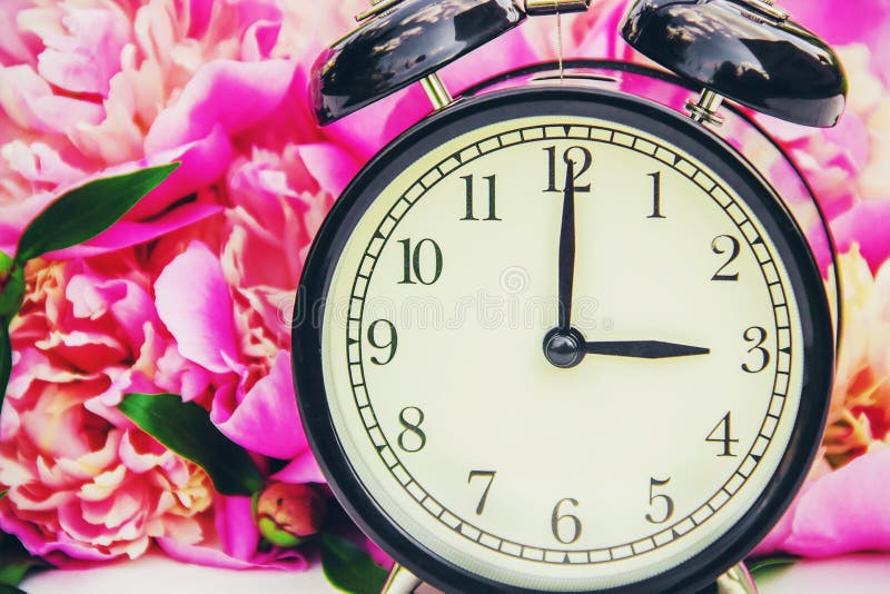 Spring Flowers and Alarm Clock. Change the Time Stock Image - Image of ...